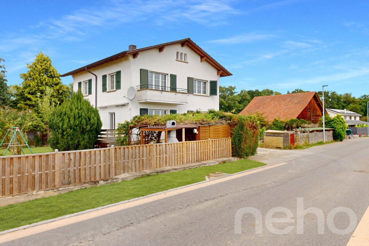 Beautiful two-family house with integrated garage and sunny garden ...